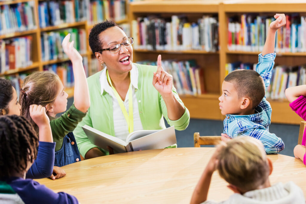 Teacher Reading to Students in School Library - Public Policy Institute ...