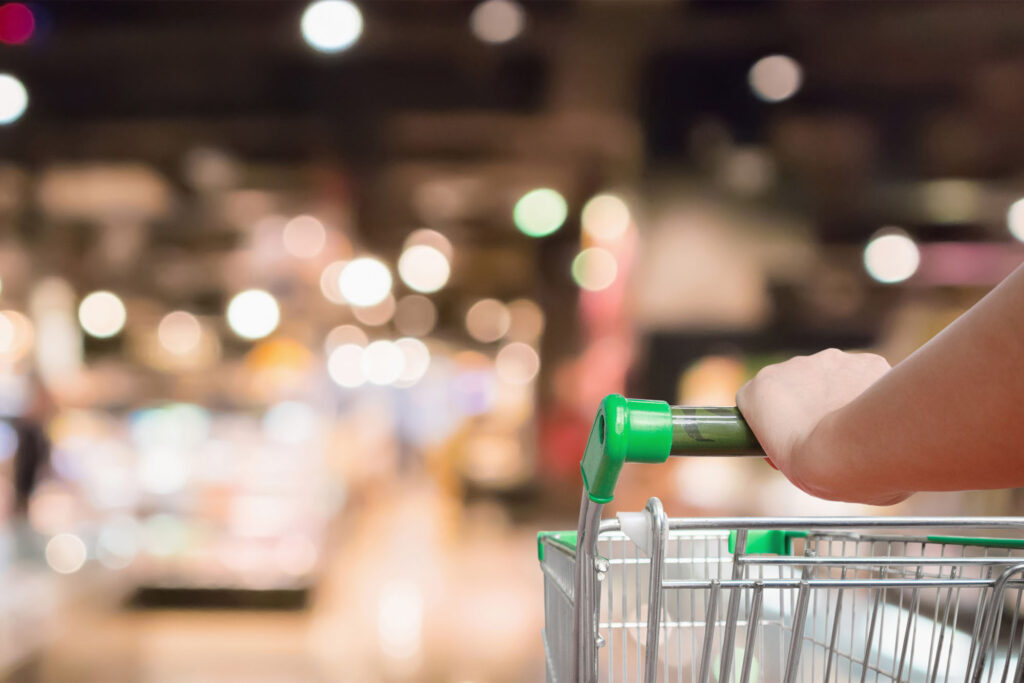 Woman's Hand Pushing Shopping Cart in Grocery Store - Public Policy ...