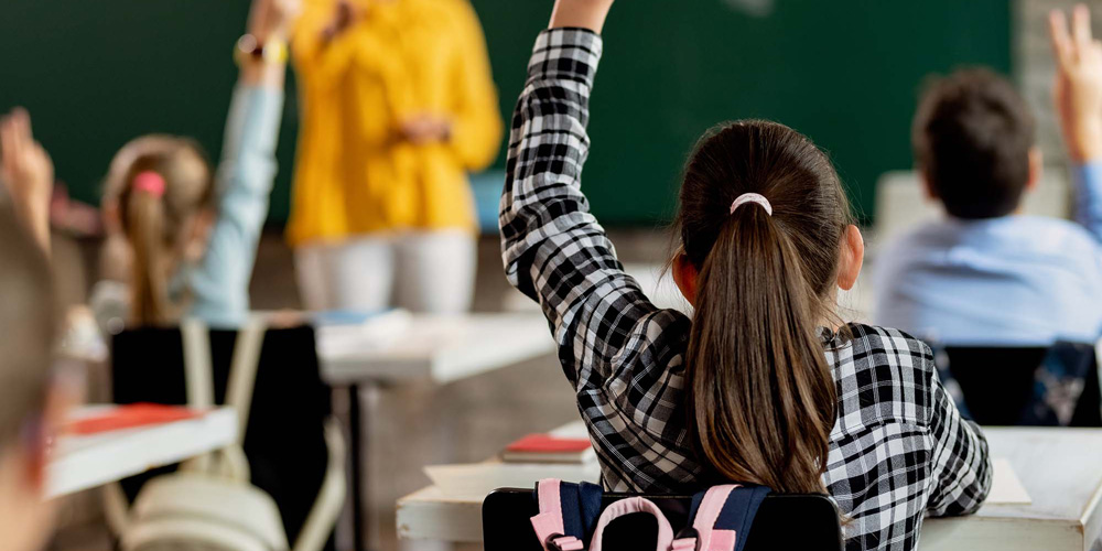 Elementary Students Classroom with Hands Raised - Public Policy ...