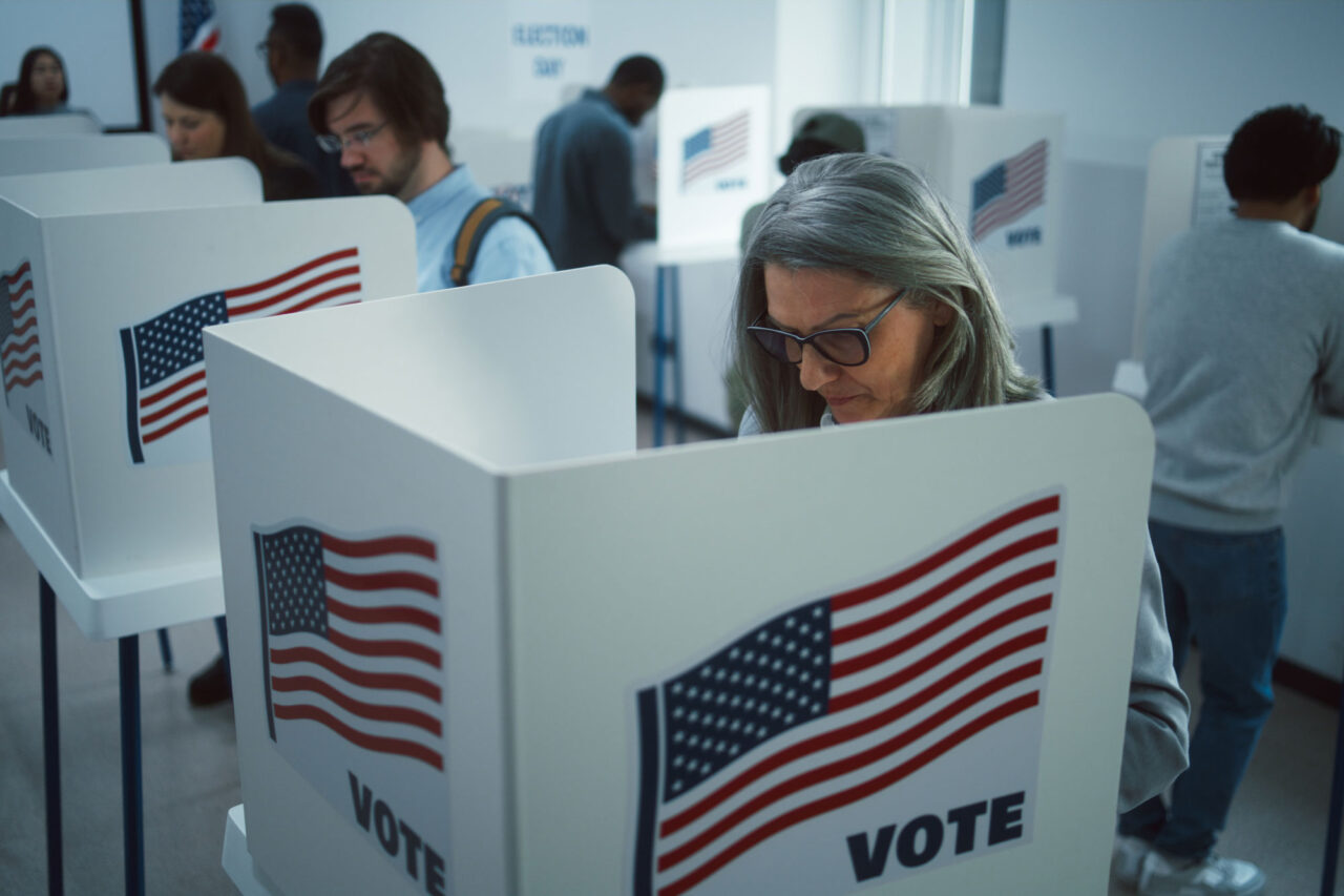 Mature Woman Votes in Booth at Polling Station - Public Policy ...