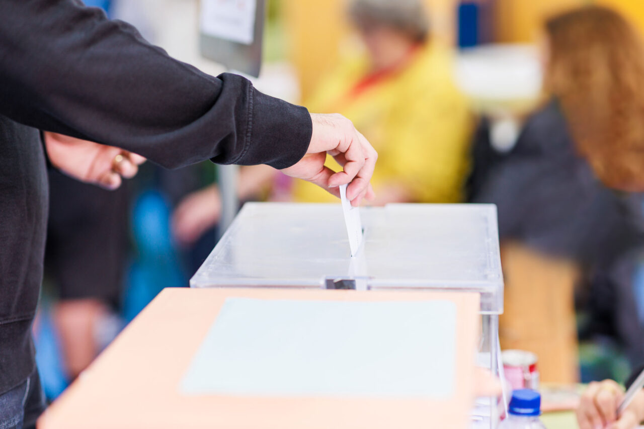 Man's Hand Submitting Ballot - Public Policy Institute of California