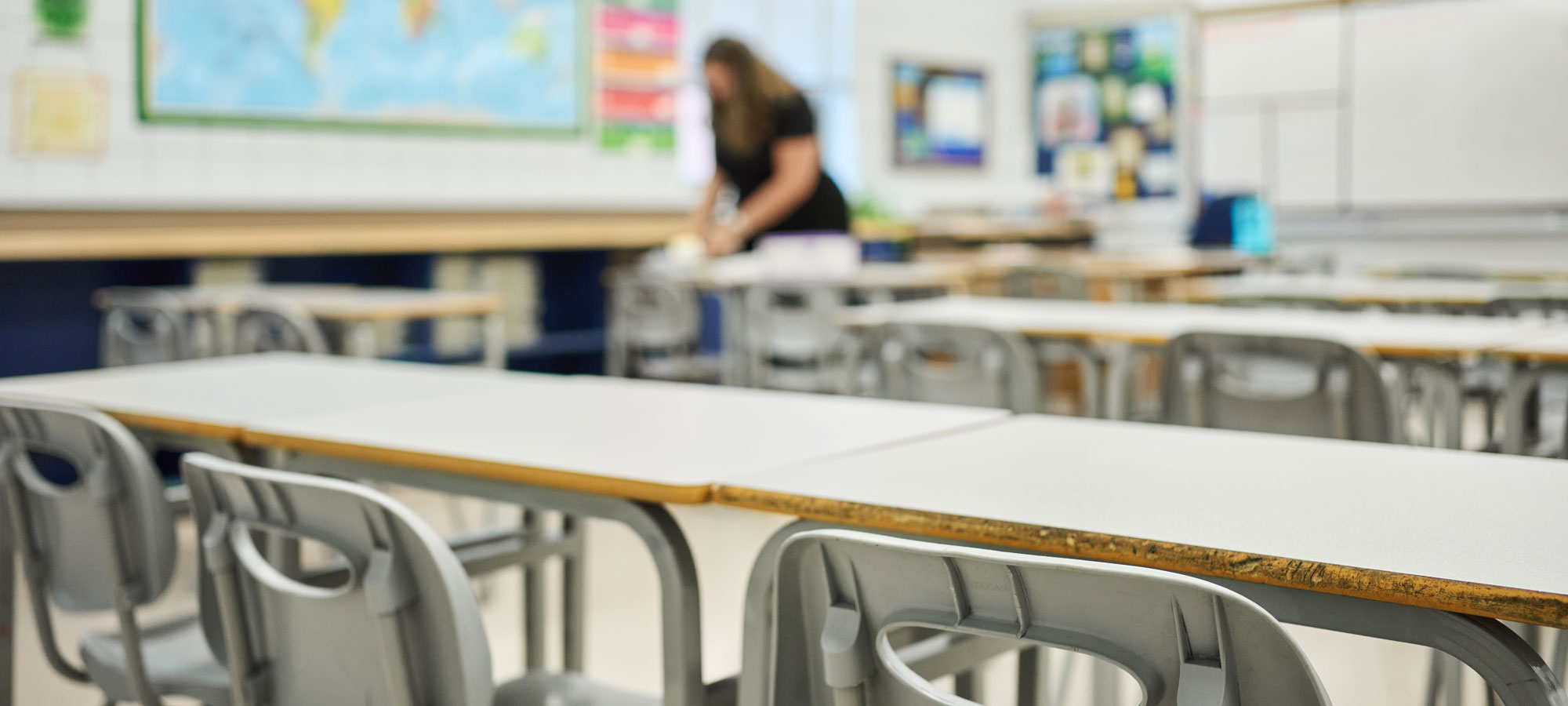 School Teacher Preparing a Lesson before Students Arrive - Public ...